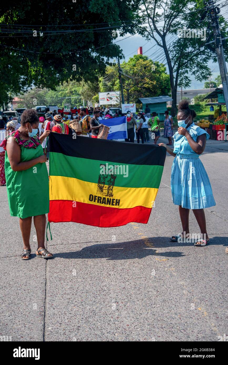 La Ceiba, Atlantida, Honduras. 31st May, 2021. Garifuna women hold an ...