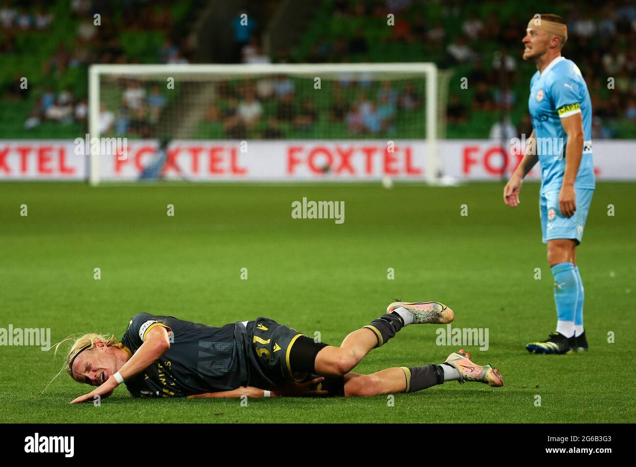 MELBOURNE, AUSTRALIA - MARCH 12: Lachlan Rose of Macarthur FC gets a ...