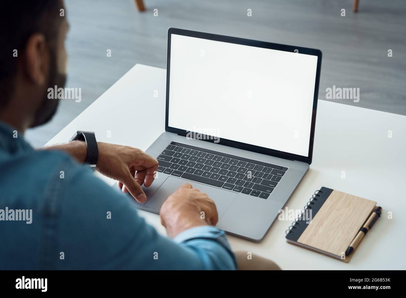 Over shoulder view of white blank empty mockup laptop screen for ...