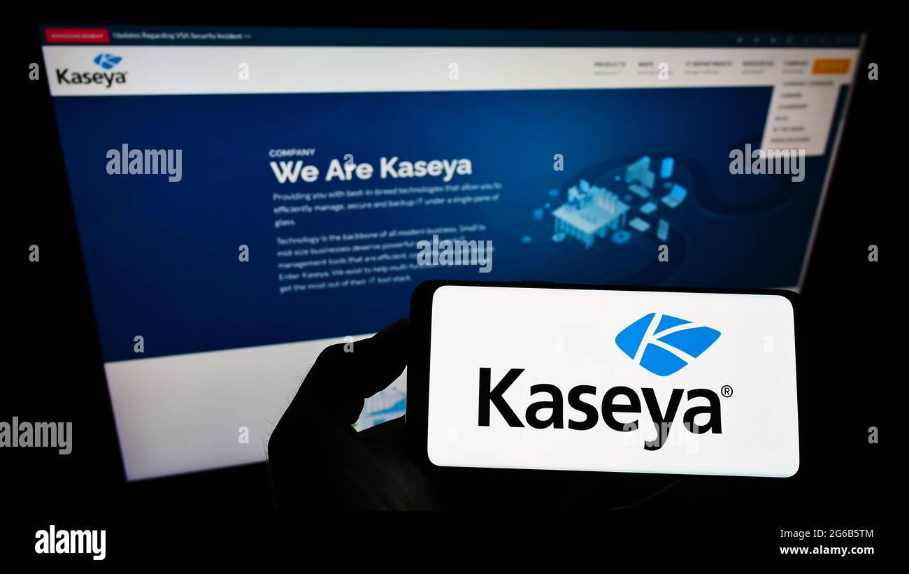 Person holding mobile phone with logo of US IT security management ...