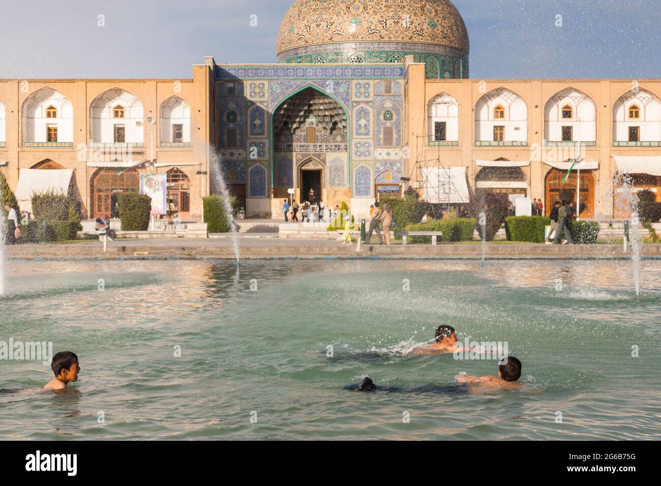 Imam square, boys swimming at fountain pool, Sheikh Lotfollah Mosque ...