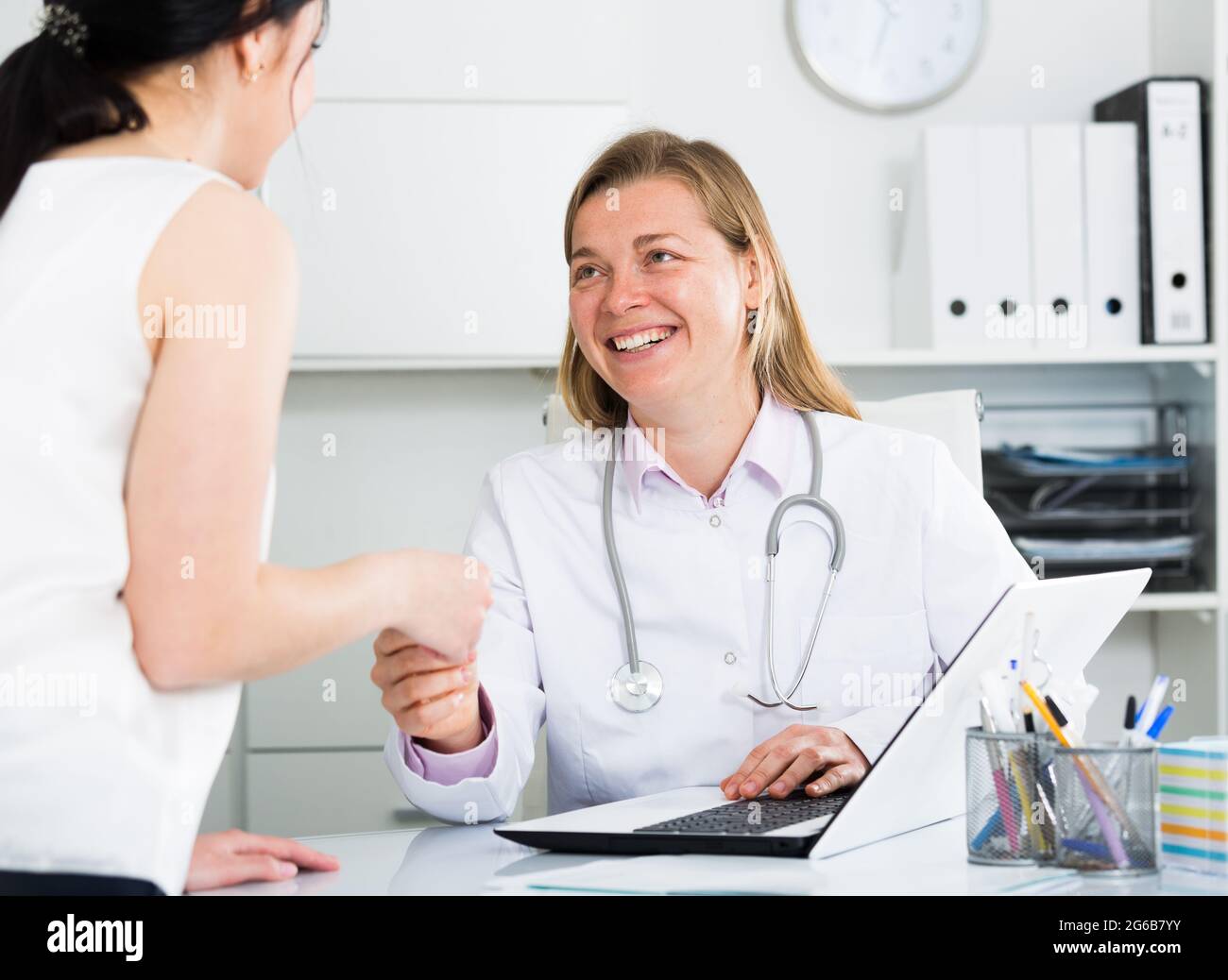 Woman visiting female doctor Stock Photo - Alamy