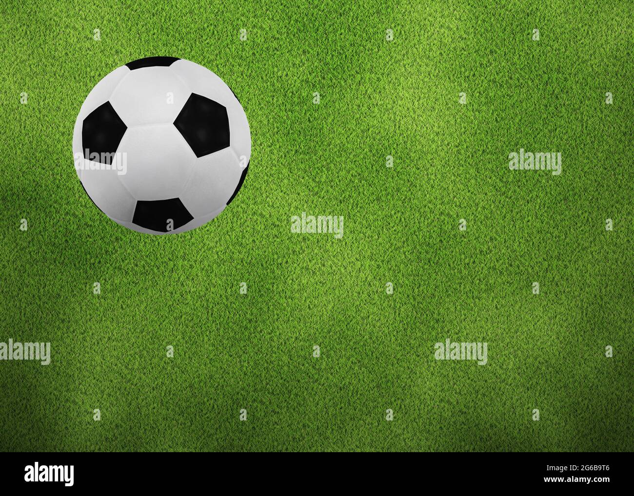 Digitally rendered soccer or football ball lying on the green grass, 3d ...