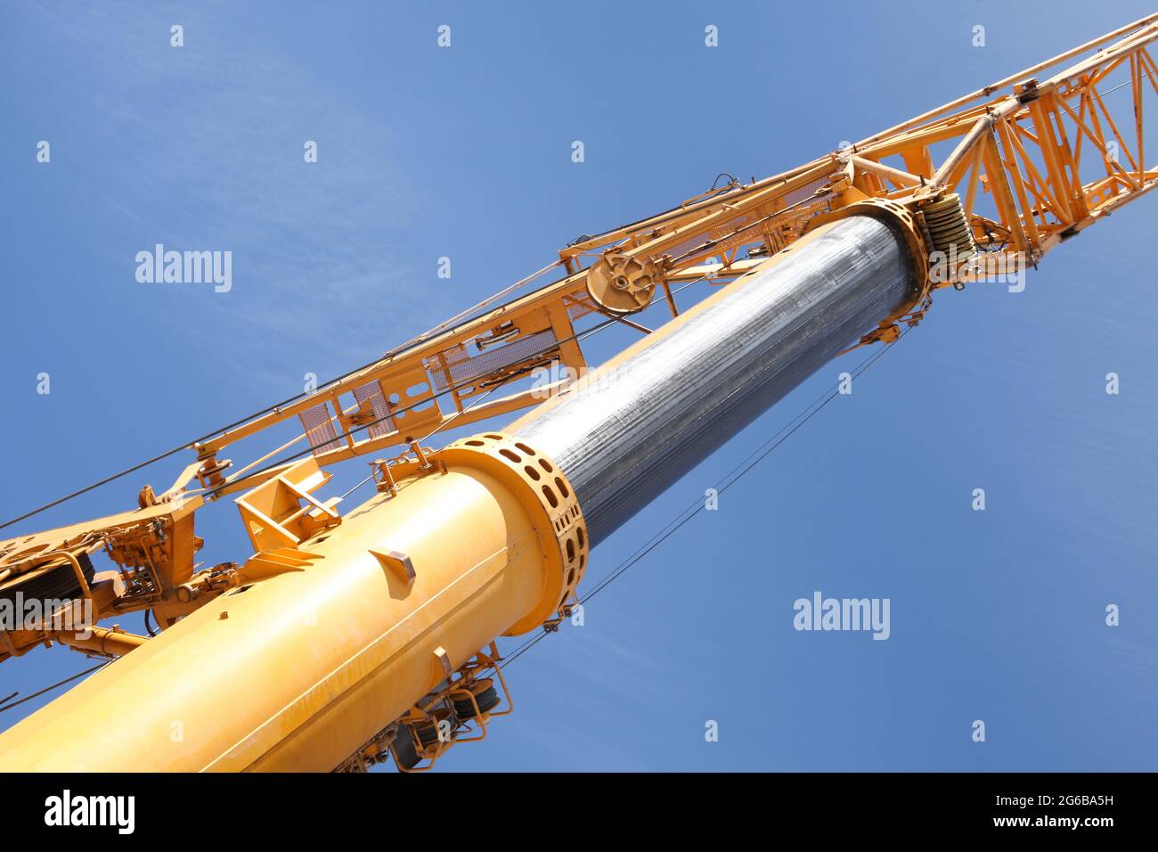 Crane towards the sky. Construction site Stock Photo - Alamy
