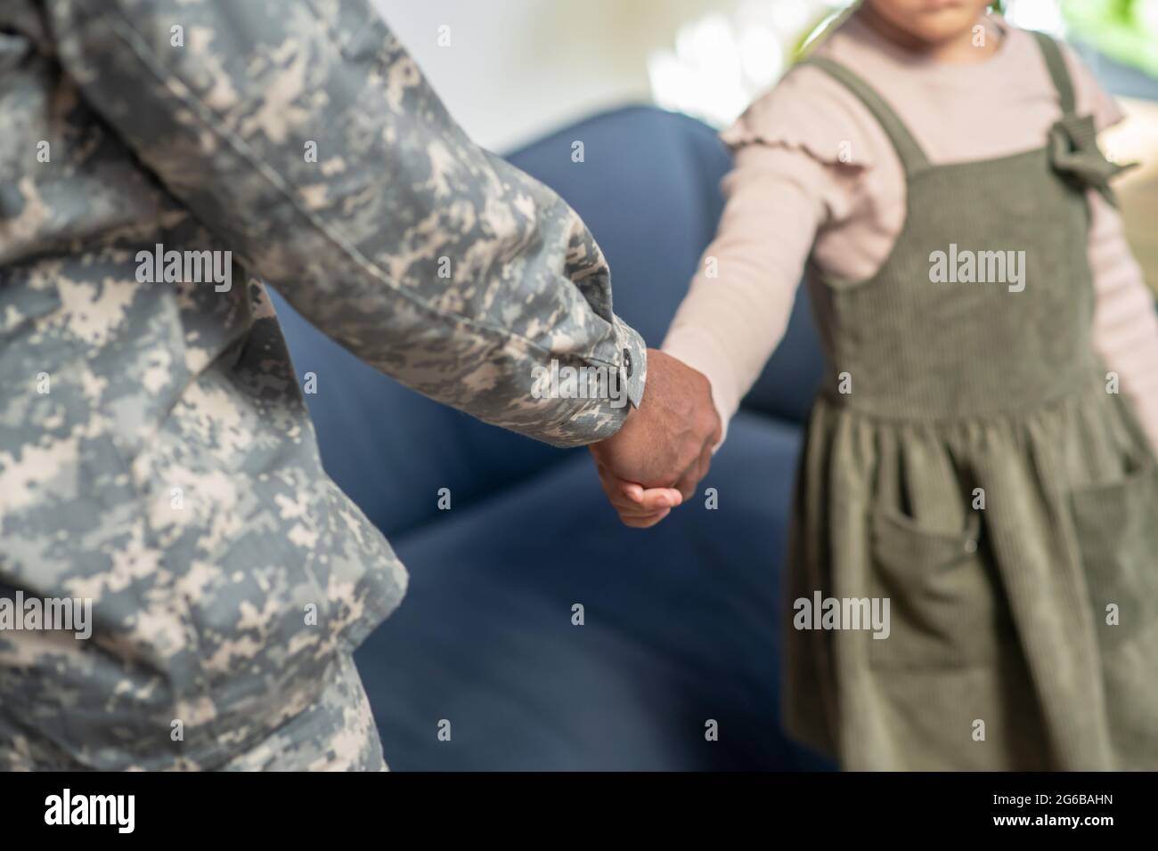 Child shaking hands with adult hi-res stock photography and images - Alamy