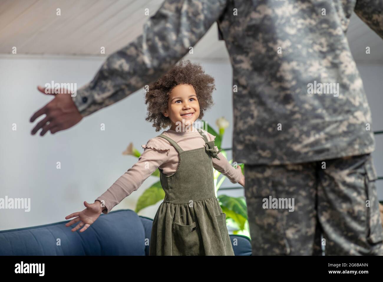 Dad with back to camera and daughter during meeting Stock Photo - Alamy