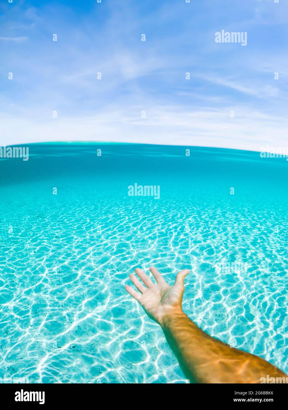 (Selective focus) Stunning view of the hand of a person in a turquoise ...