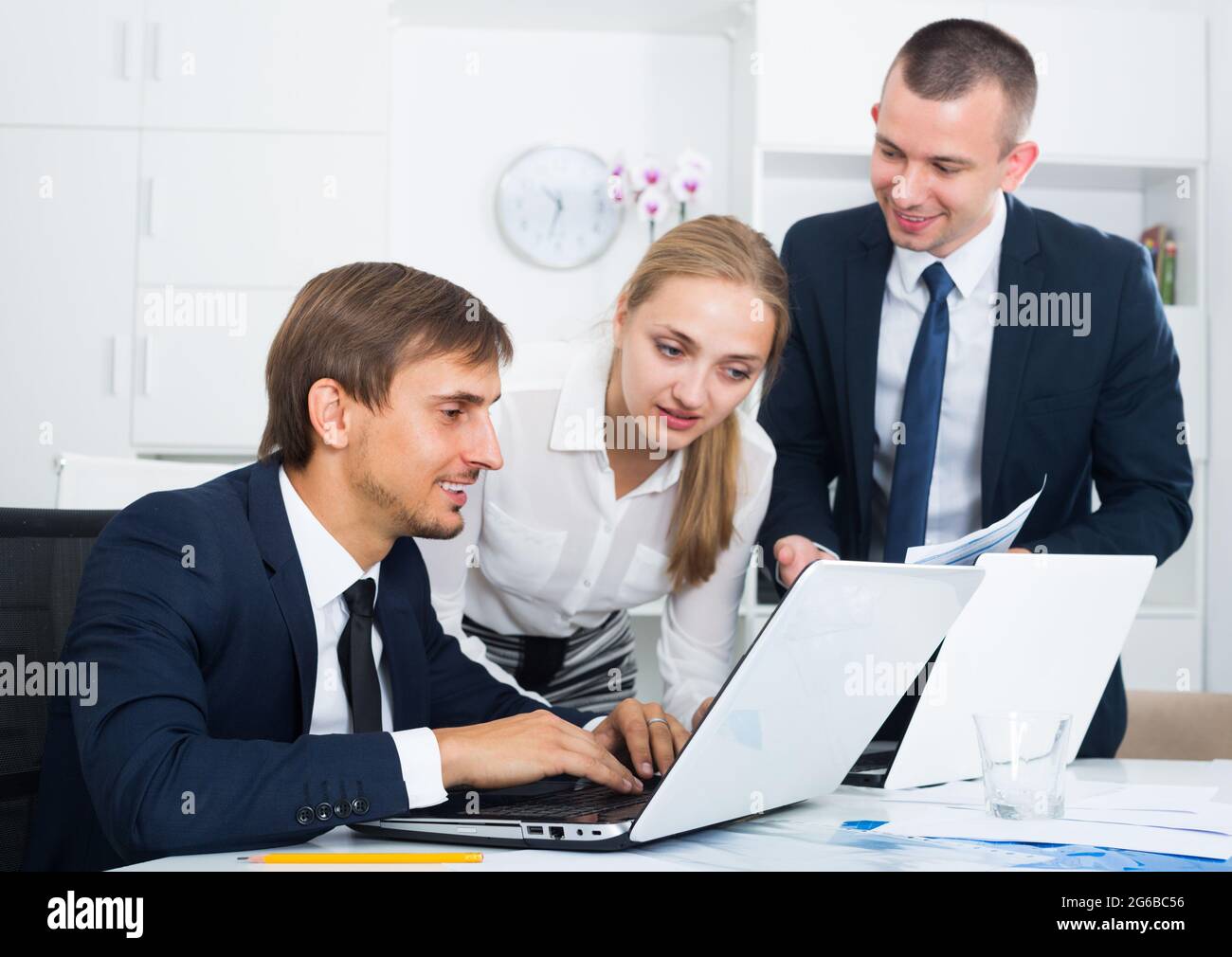 business colleagues with laptops in office Stock Photo - Alamy