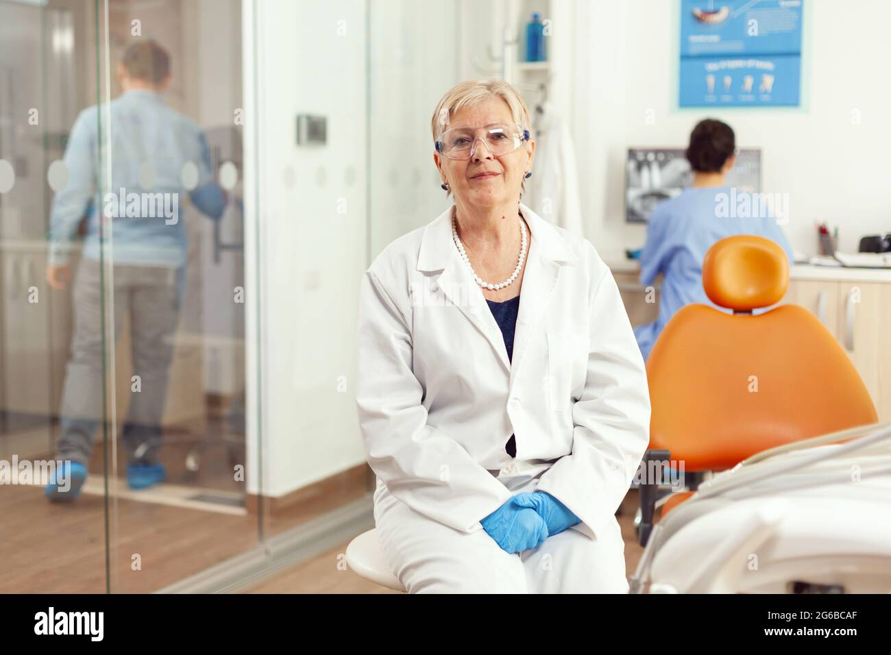 Portrait of specialist doctor working in stomatological office room ...