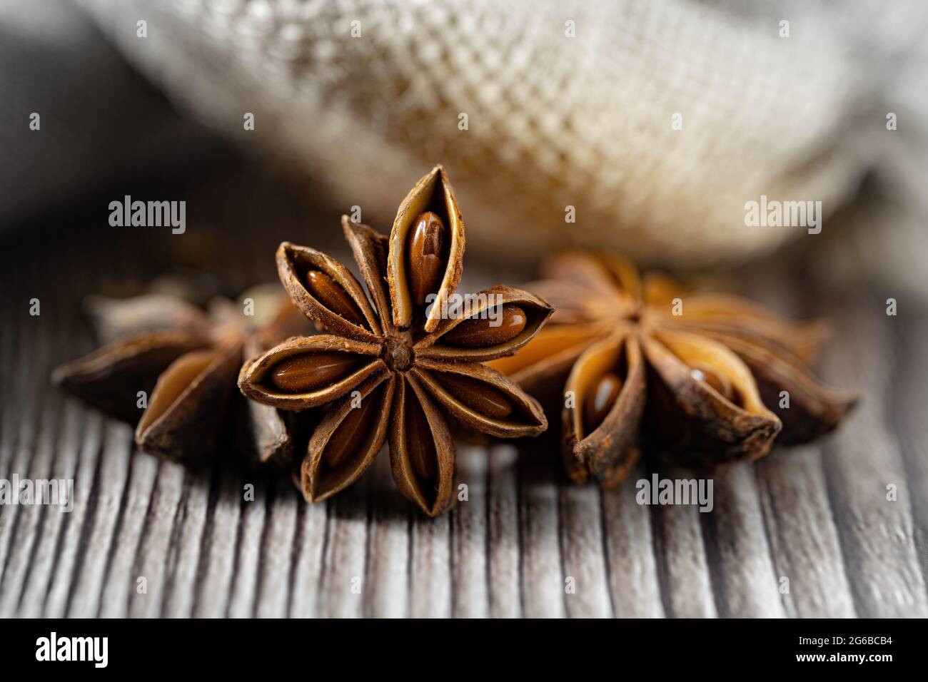 close up to star anise on wooden table, food concept Stock Photo - Alamy