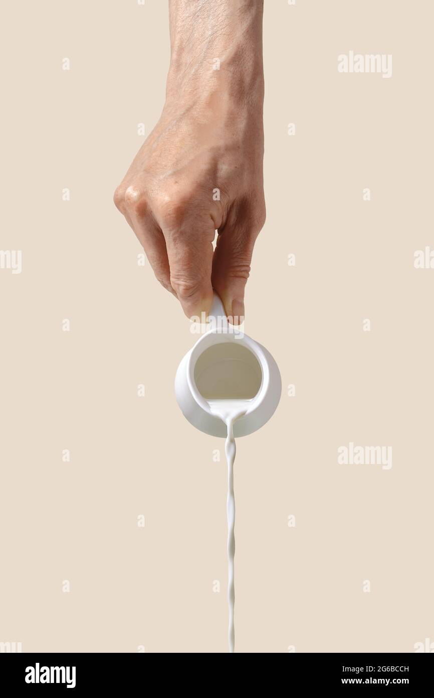 Pouring milk to pot hi-res stock photography and images - Alamy