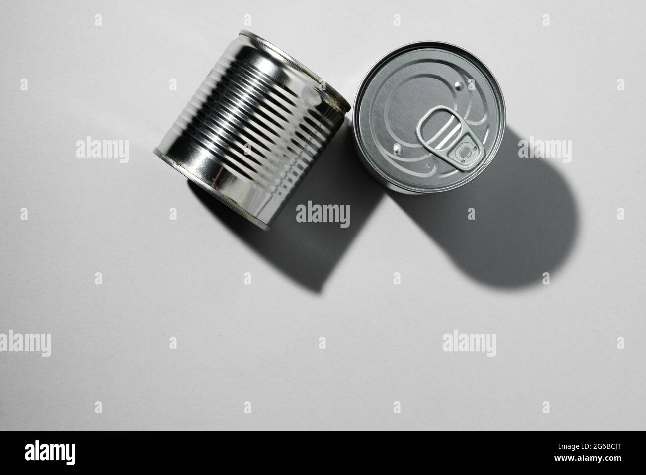 Tin can for food on gray background Stock Photo - Alamy
