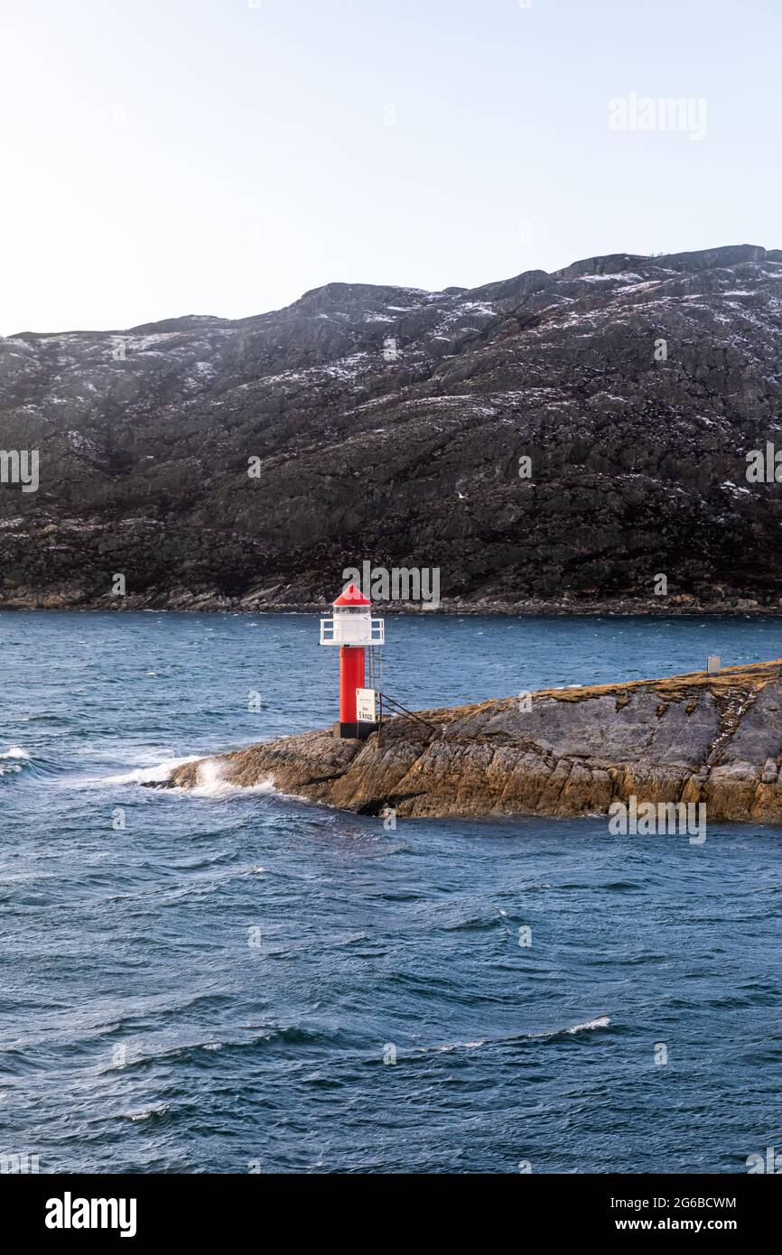 Lighthouse on rocks and sailing speed limit sign, Norway Stock Photo ...