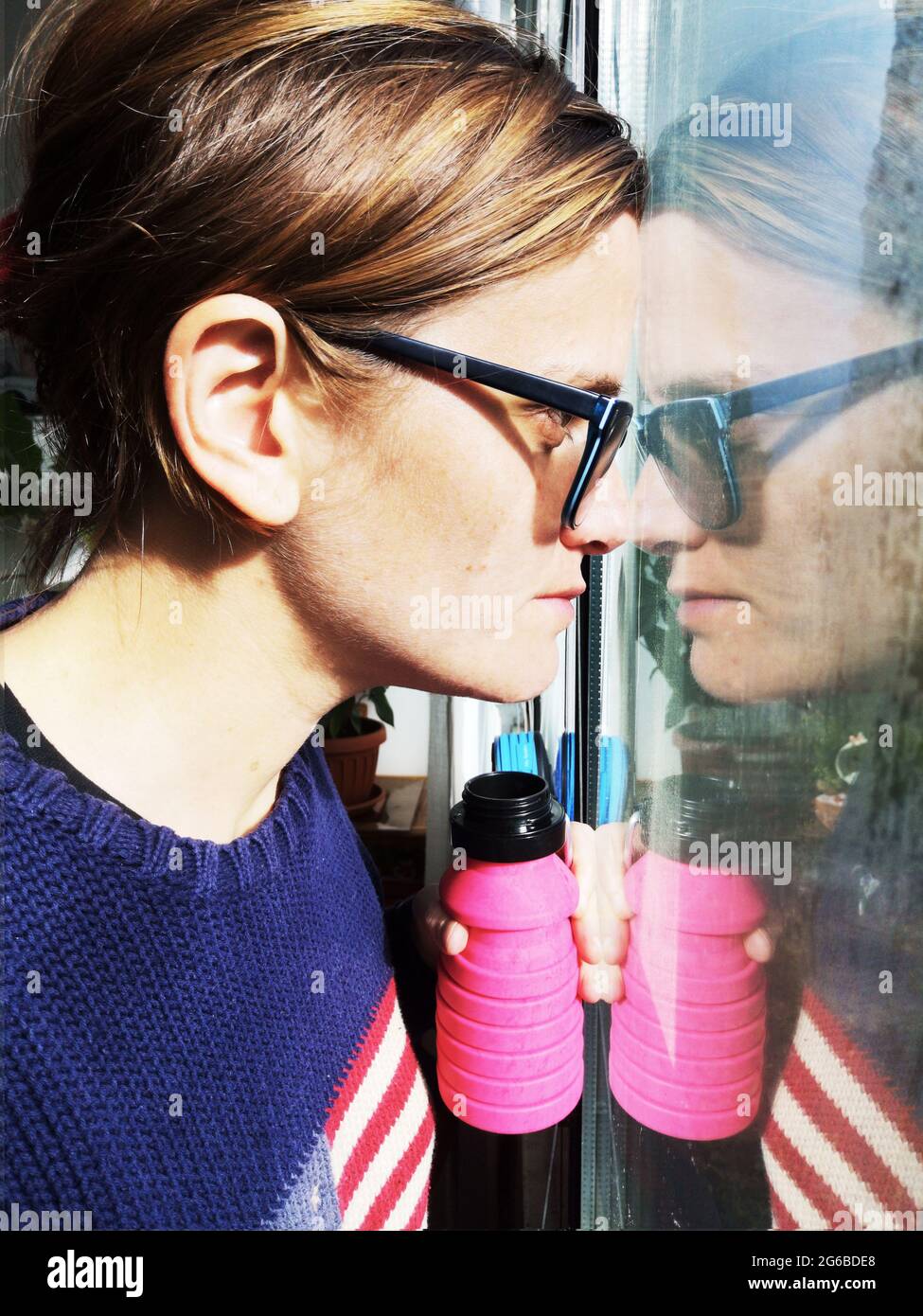 Watching waiting glass reflection window hi-res stock photography and ...