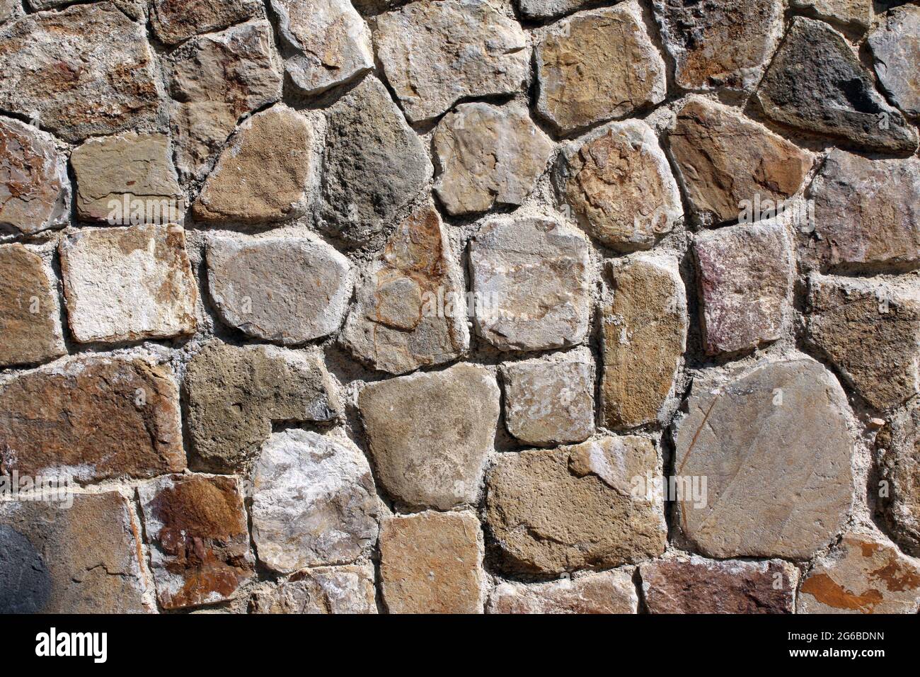 Ancient wall of stone blocks of different color and sizes Stock Photo ...