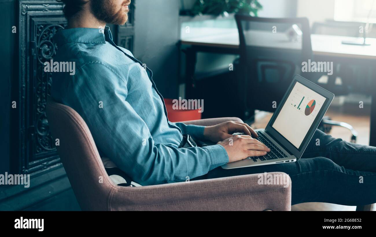Young man look at the graph hi-res stock photography and images - Alamy