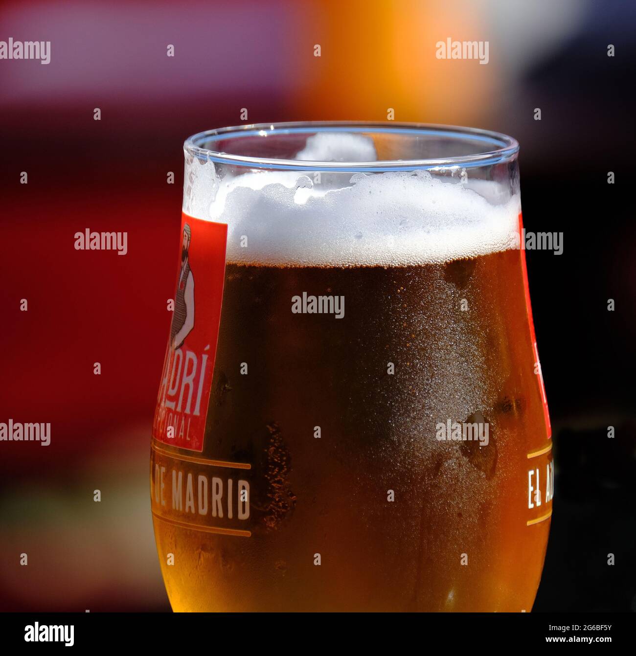 Beer with froth head in a glass outdoors Stock Photo - Alamy