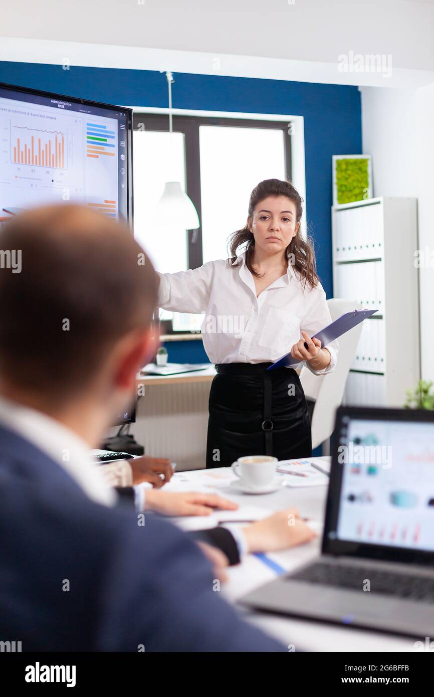 Woman executive leader coach presenter giving financial presentation in ...