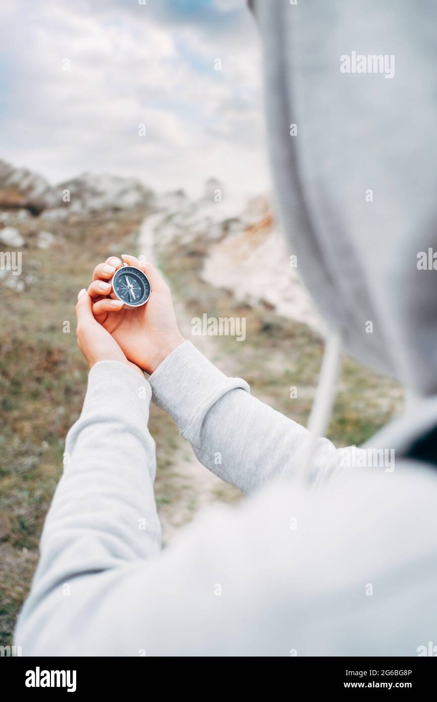 Female hiker looking compass hi-res stock photography and images - Alamy