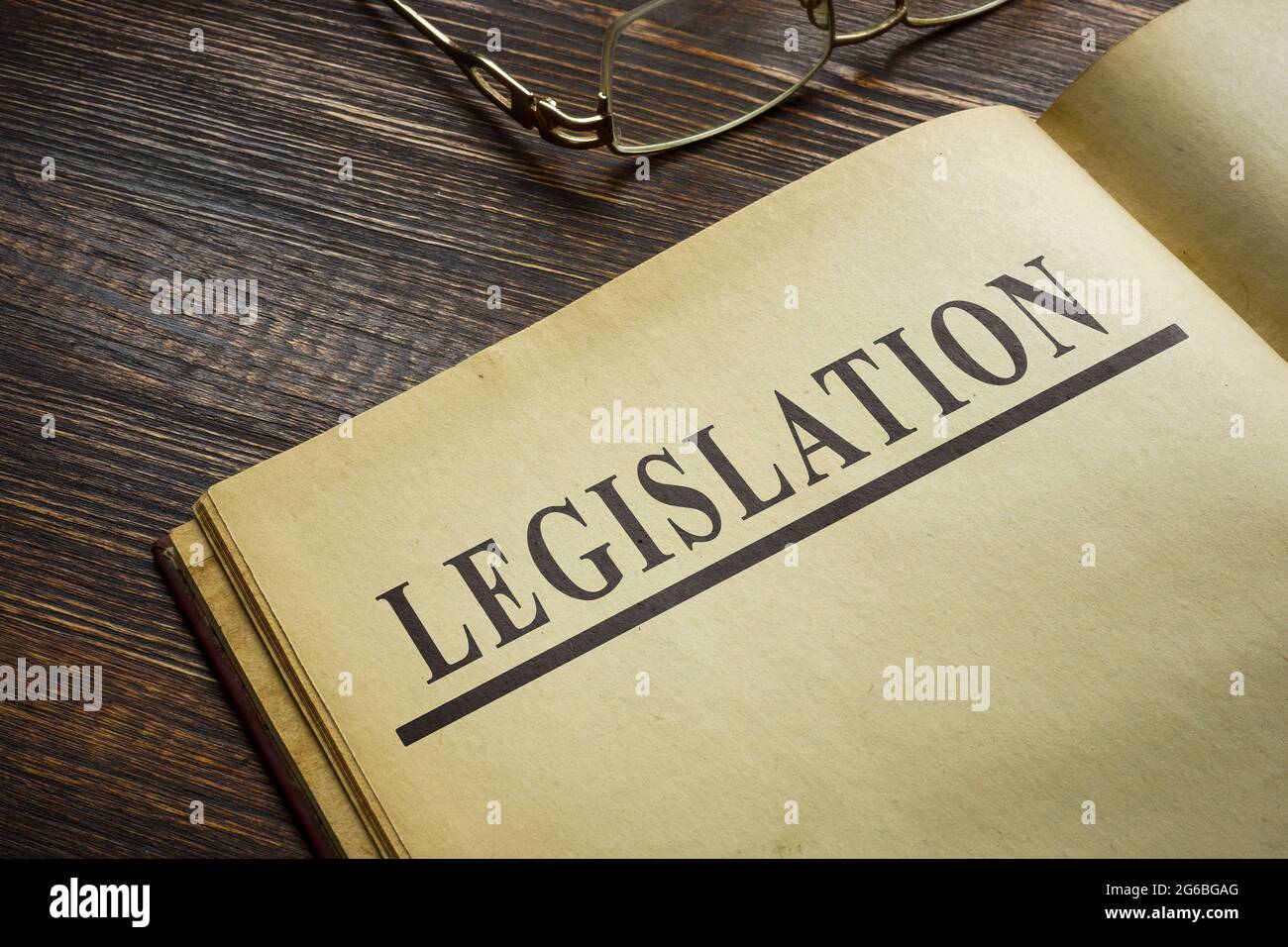 Open book on a page with a topic legislation Stock Photo - Alamy