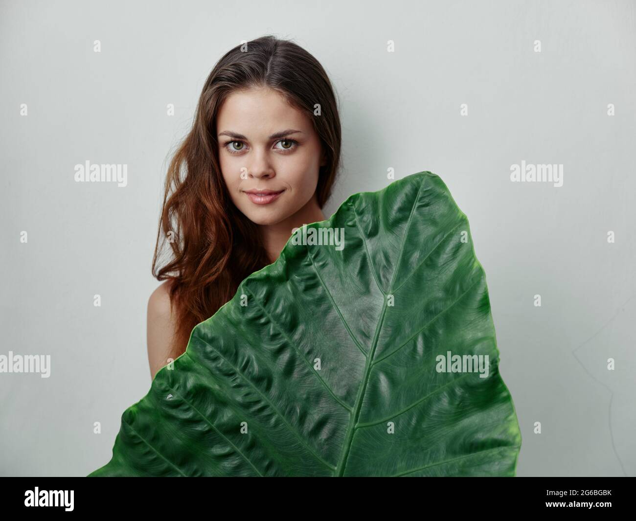 pretty charming woman palm green leaf exotic Stock Photo - Alamy