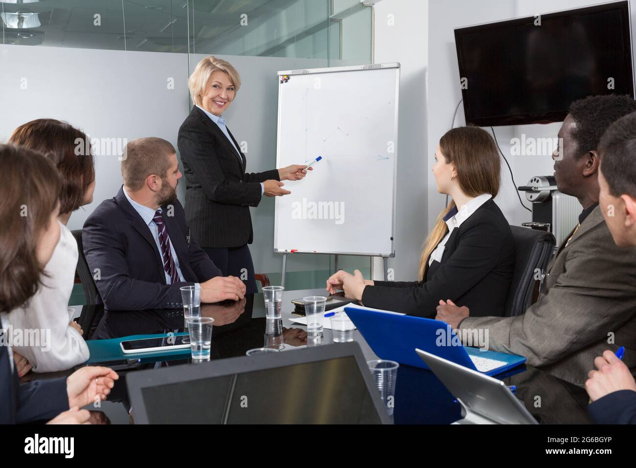 business woman presenting new business strategy Stock Photo - Alamy