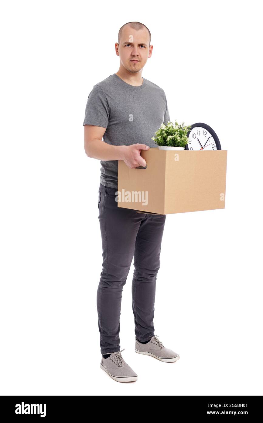 portrait of young man holding box with belongings isolated on white ...