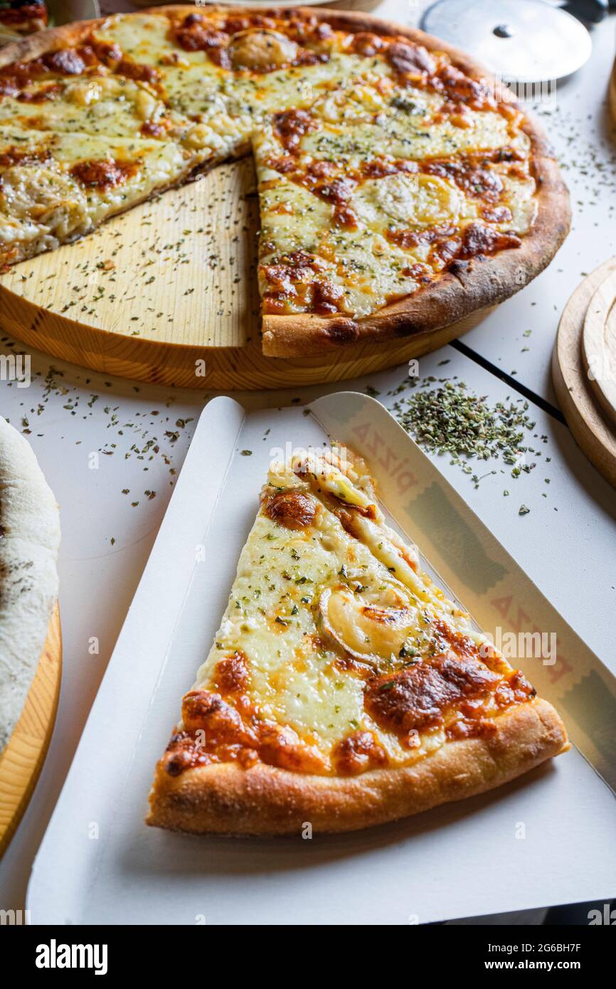 Pizza slices on the table on white background. Pizza menu. Vertical ...