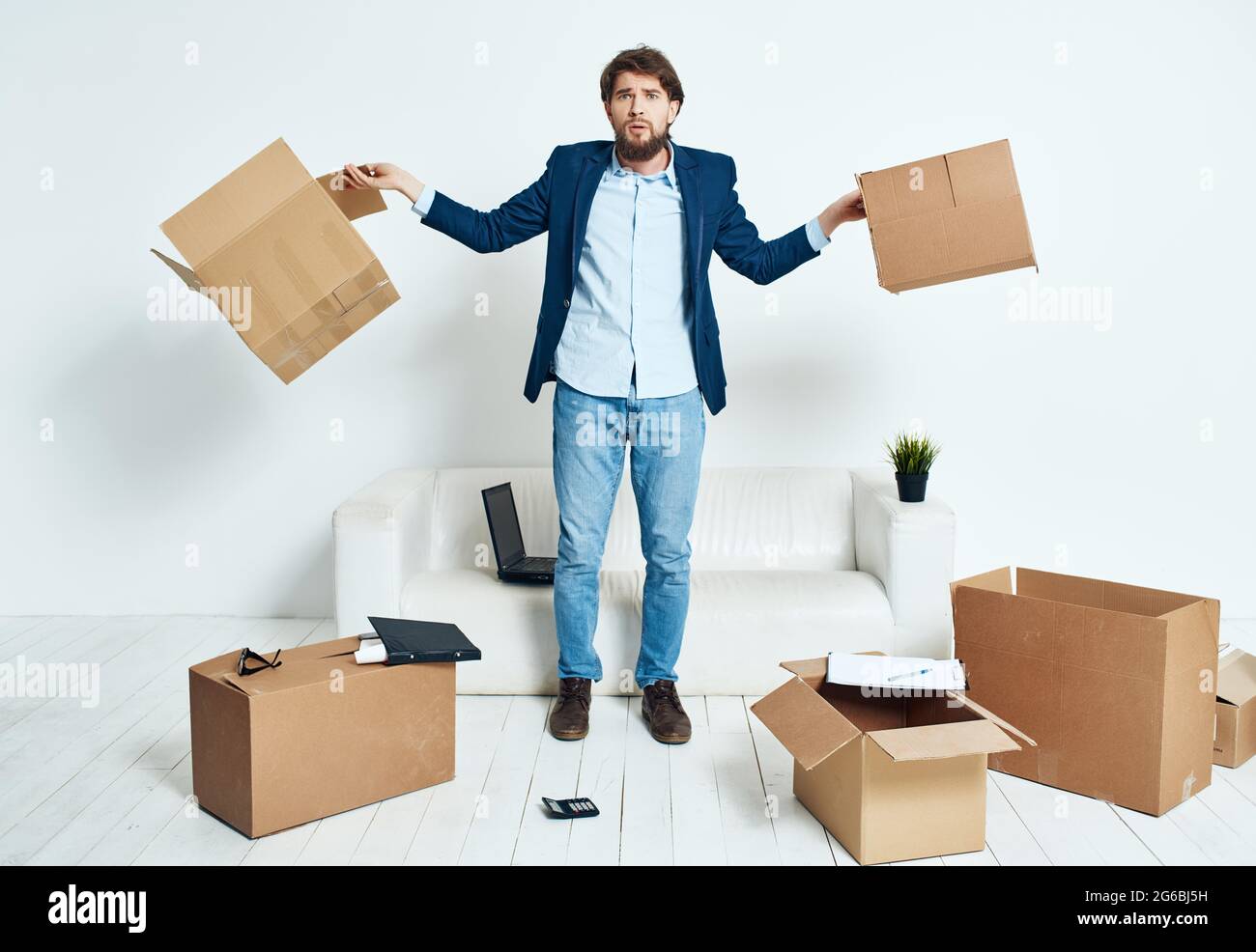 manager with cardboard boxes office moving professional Stock Photo - Alamy