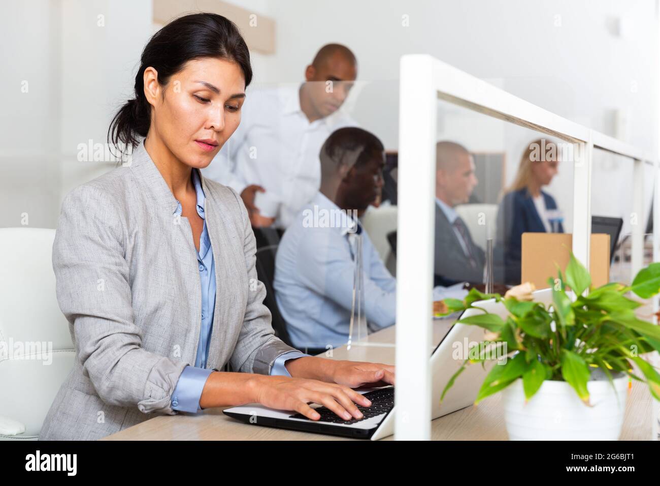 positive asian female manager in white office Stock Photo - Alamy