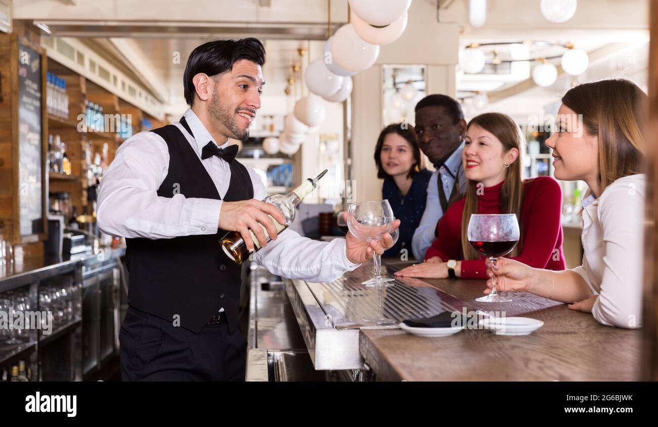 Barman serving drinks on bar Stock Photo - Alamy