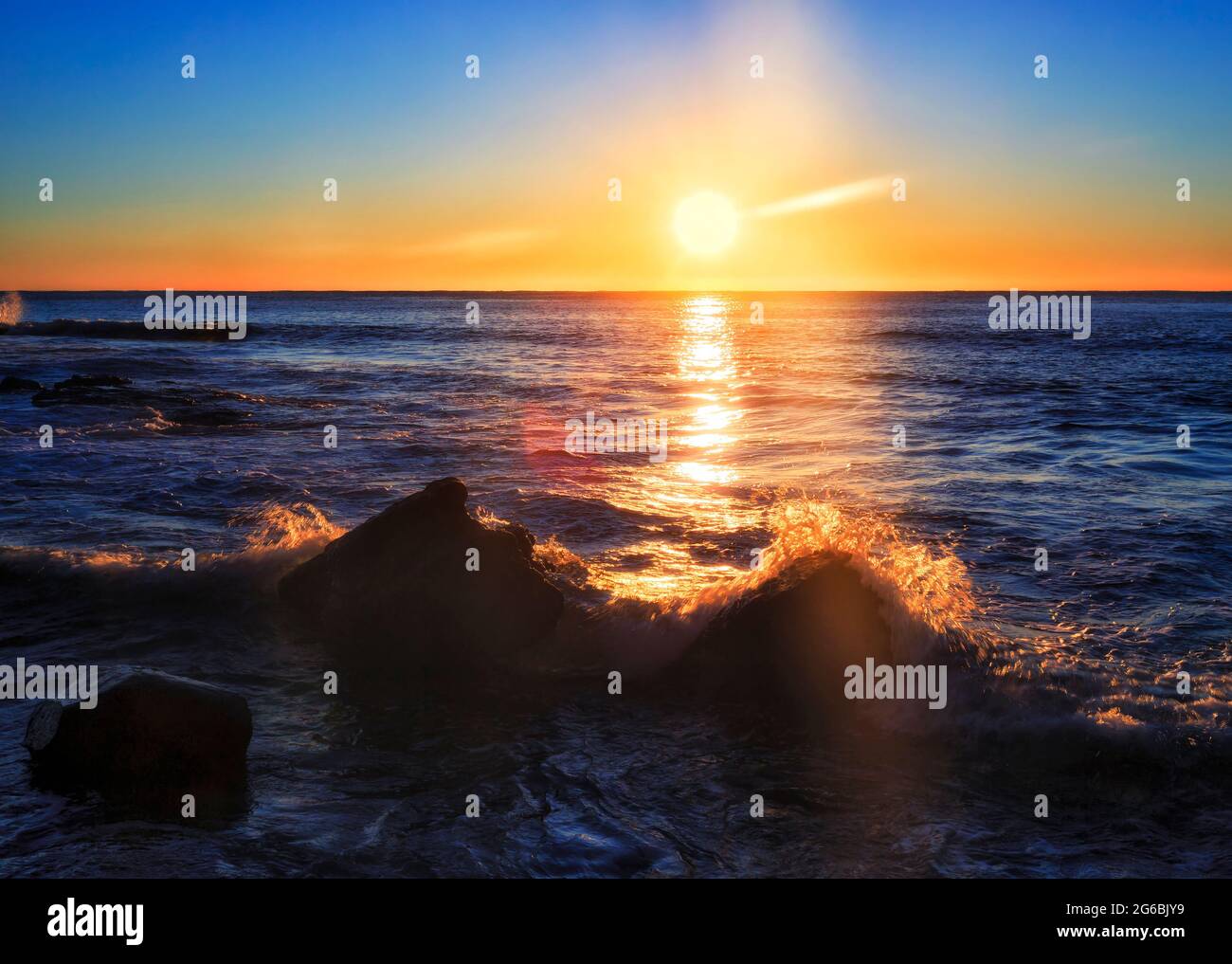 Contrast against rising sun over Pacific ocean horizon off Newport ...