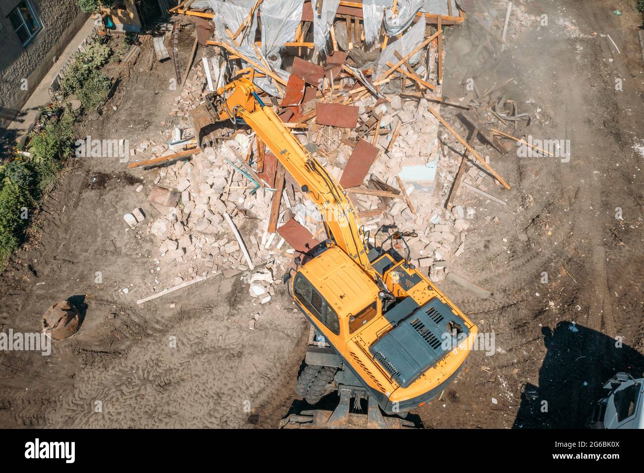 Hydraulic Excavator Breaks House. Building Demolition or Destruction ...