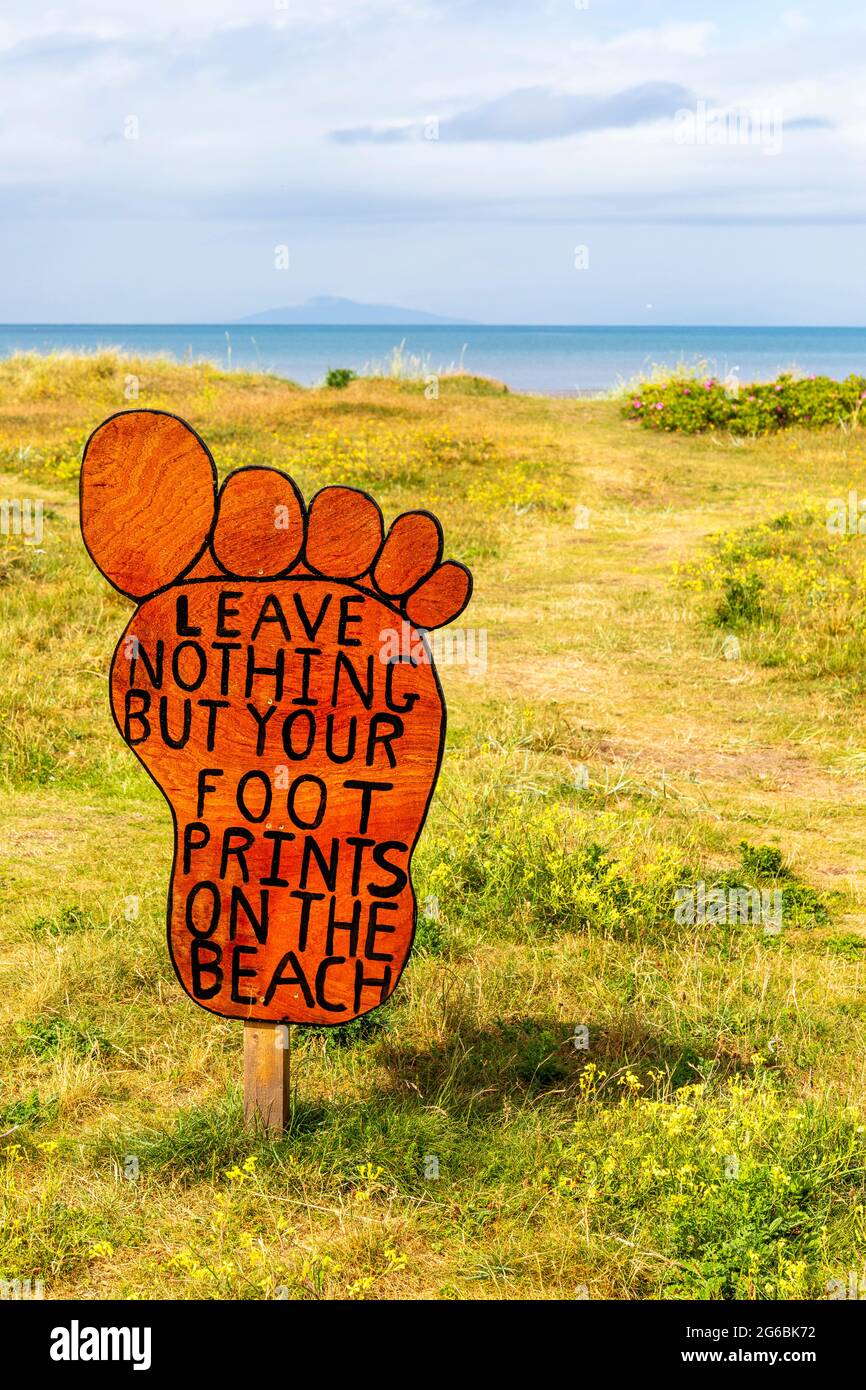 Anti pollution sign in the shape of a foot, on the access path to the ... Anti pollution sign in the shape of a foot, on the access path to the ...