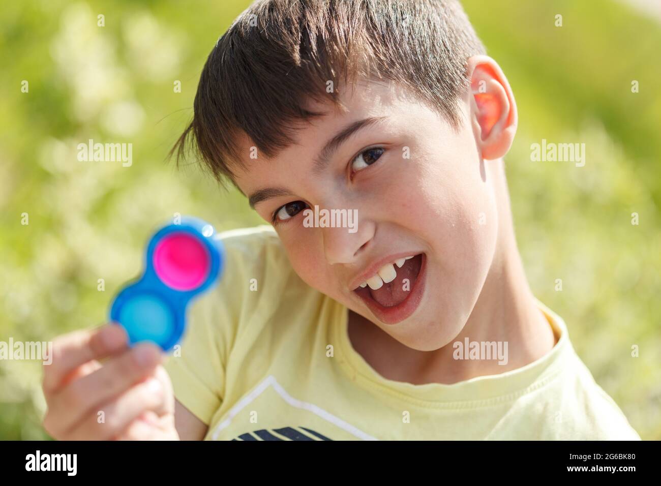 Antistress toy, the child holds in his hand pop it Stock Photo - Alamy