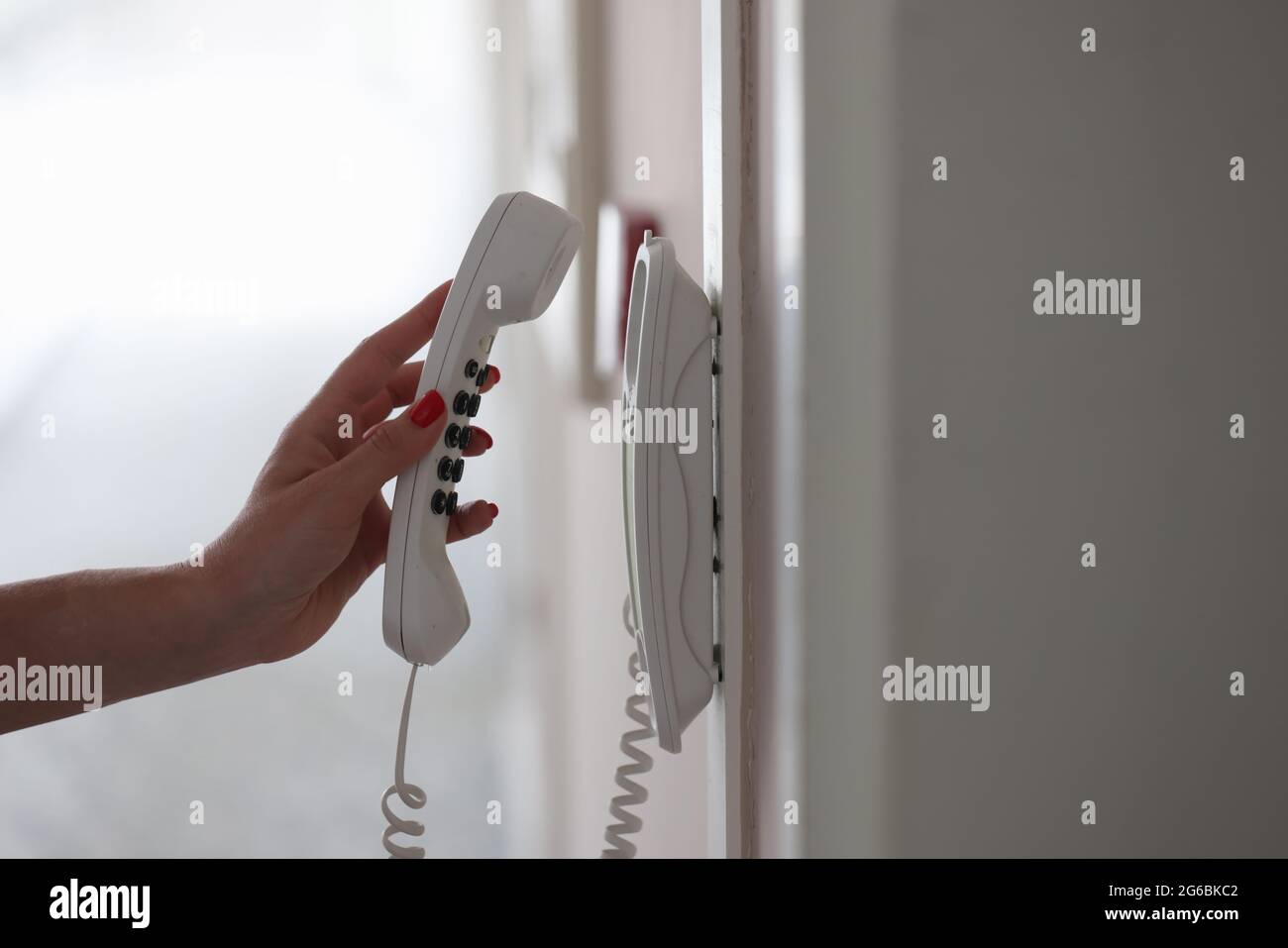 Hand picking up phone hi-res stock photography and images - Alamy