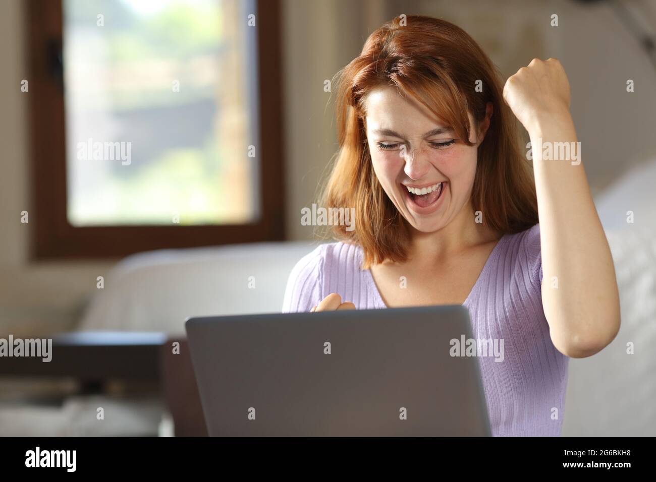 Excited woman computer home hi-res stock photography and images - Alamy