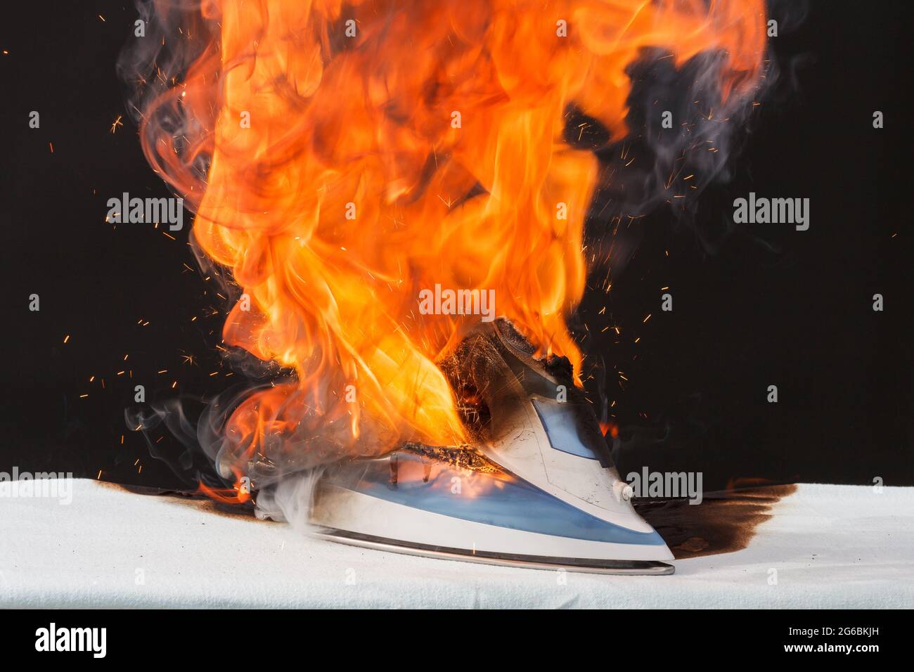 On the ironing board fire caused by faulty electrical wiring Stock ...