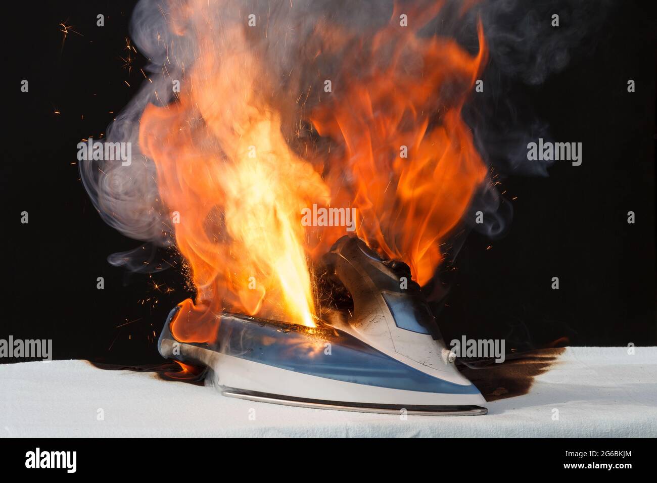 On the ironing board fire caused by faulty electrical wiring Stock ...