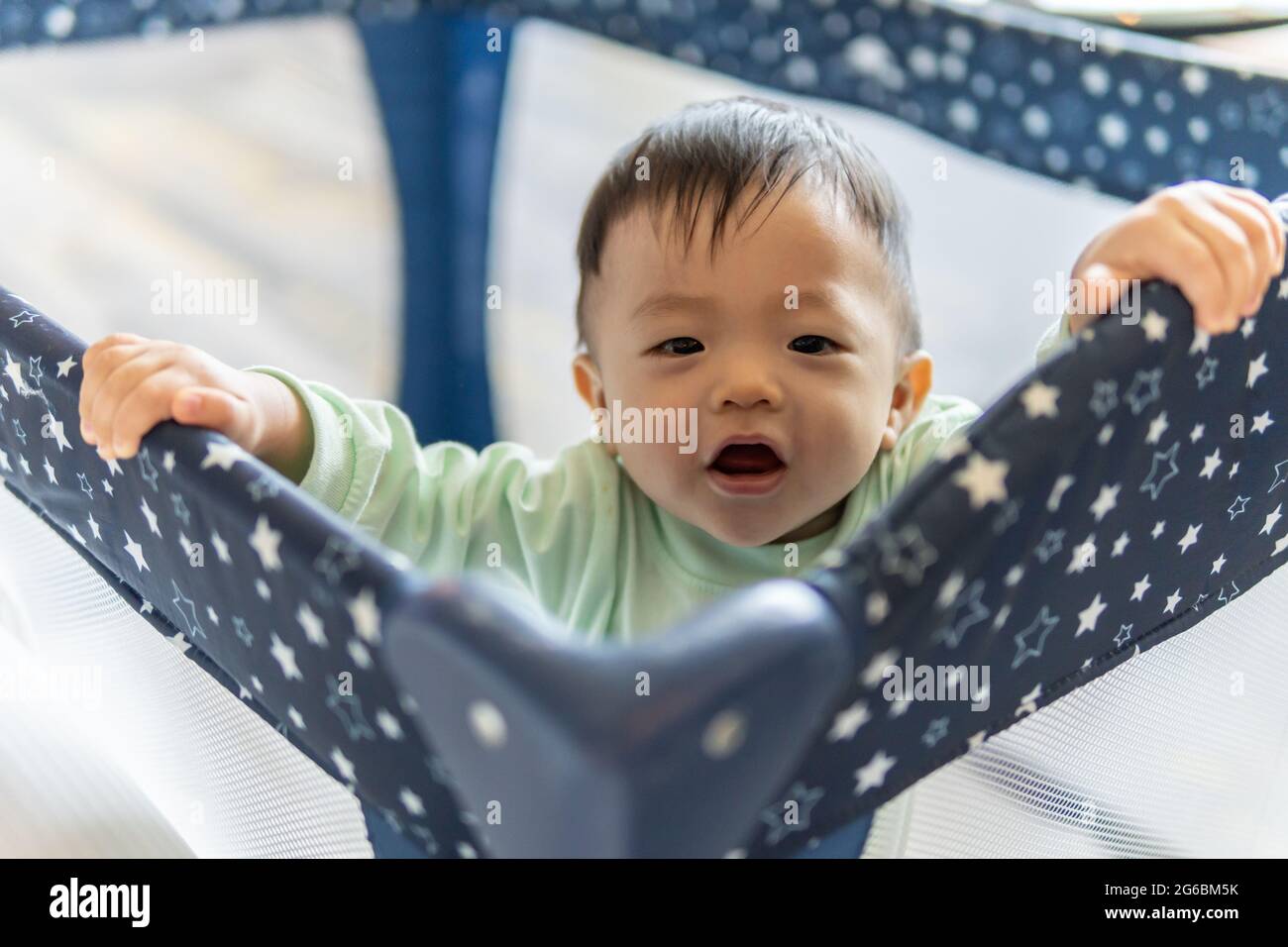 Portrait image of happy local lifestyle Asian Chinese baby play alone ...