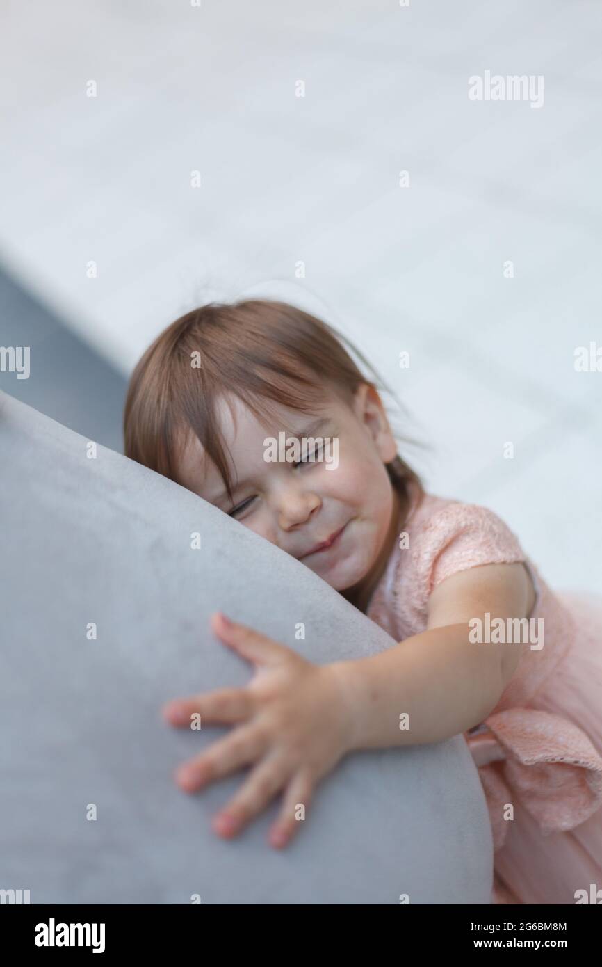 Little child hugs with love, soft toy Stock Photo - Alamy