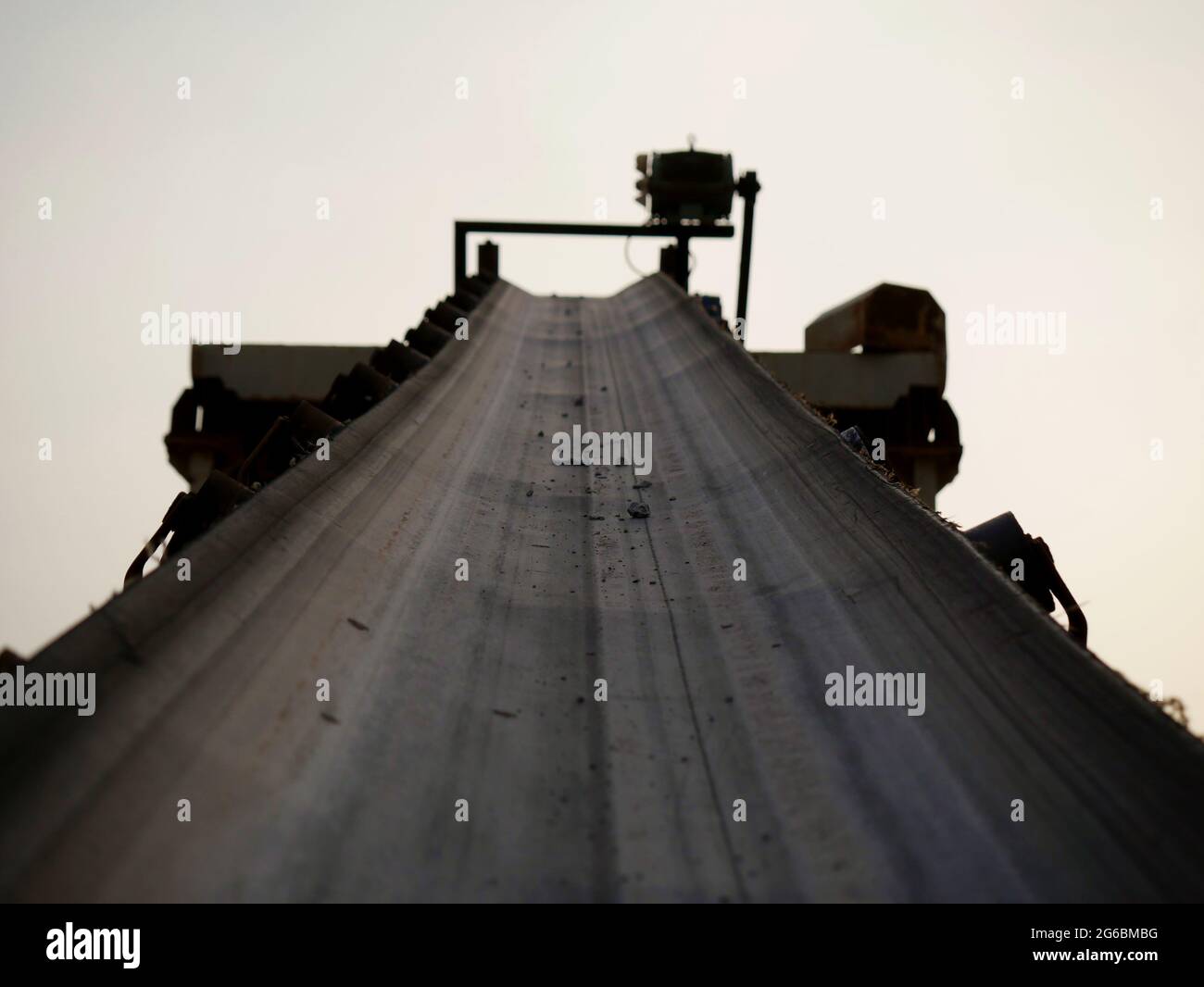 Conveyer belt concrete mixer machine presenting white sky industrial ...