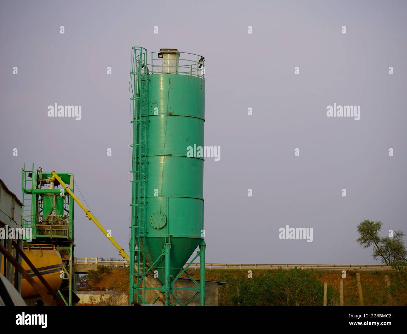 concrete mixer cylinder for construction work presenting around sky ...