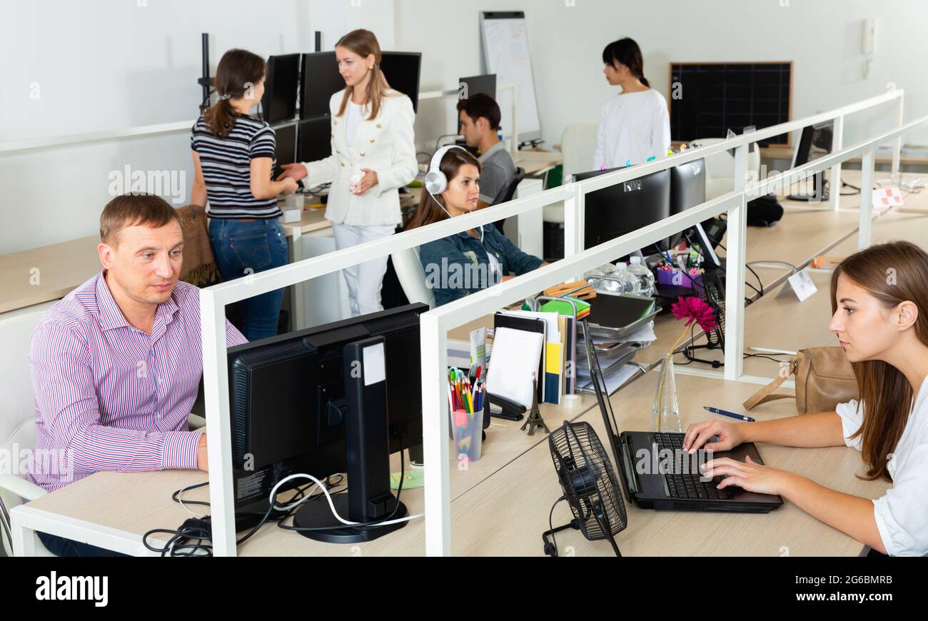 People working with computers and laptops in modern office Stock Photo ...