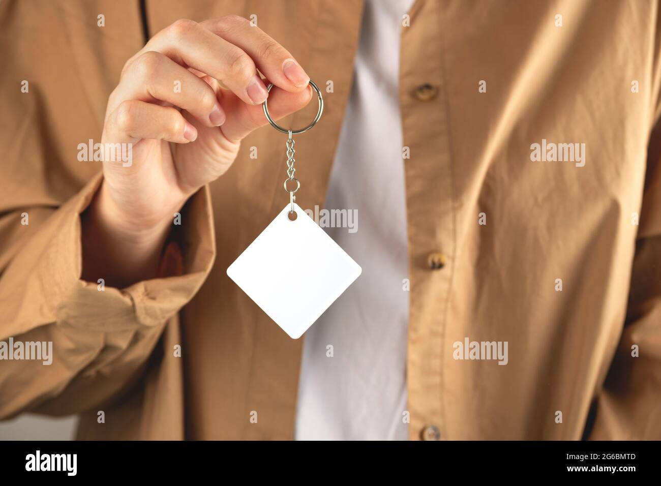 Keychain mockup to display design. Key chain mock up in woman hand ...