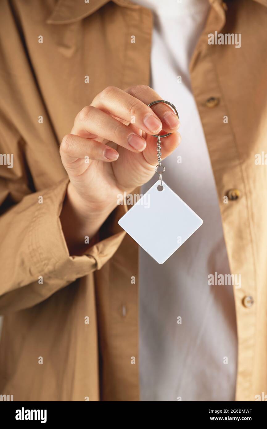 Keychain mockup to display design. Key chain mock up in woman hand ...
