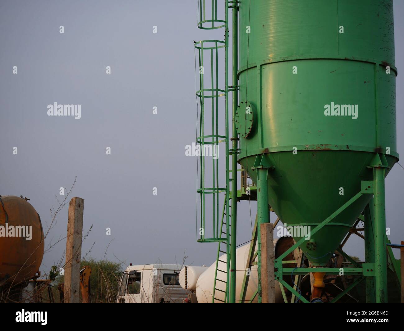 Asian concrete mixer machine presenting around sky industrial ...