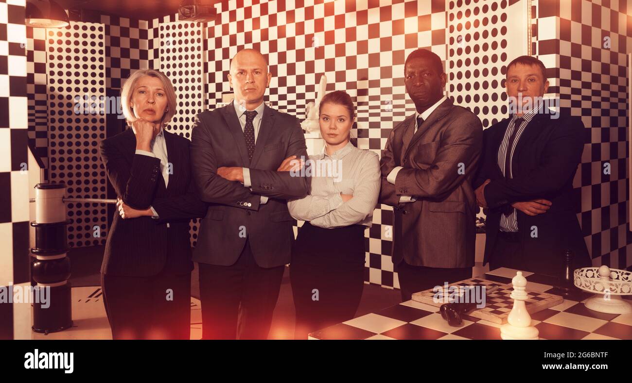Thoughtful people at escape room Stock Photo - Alamy