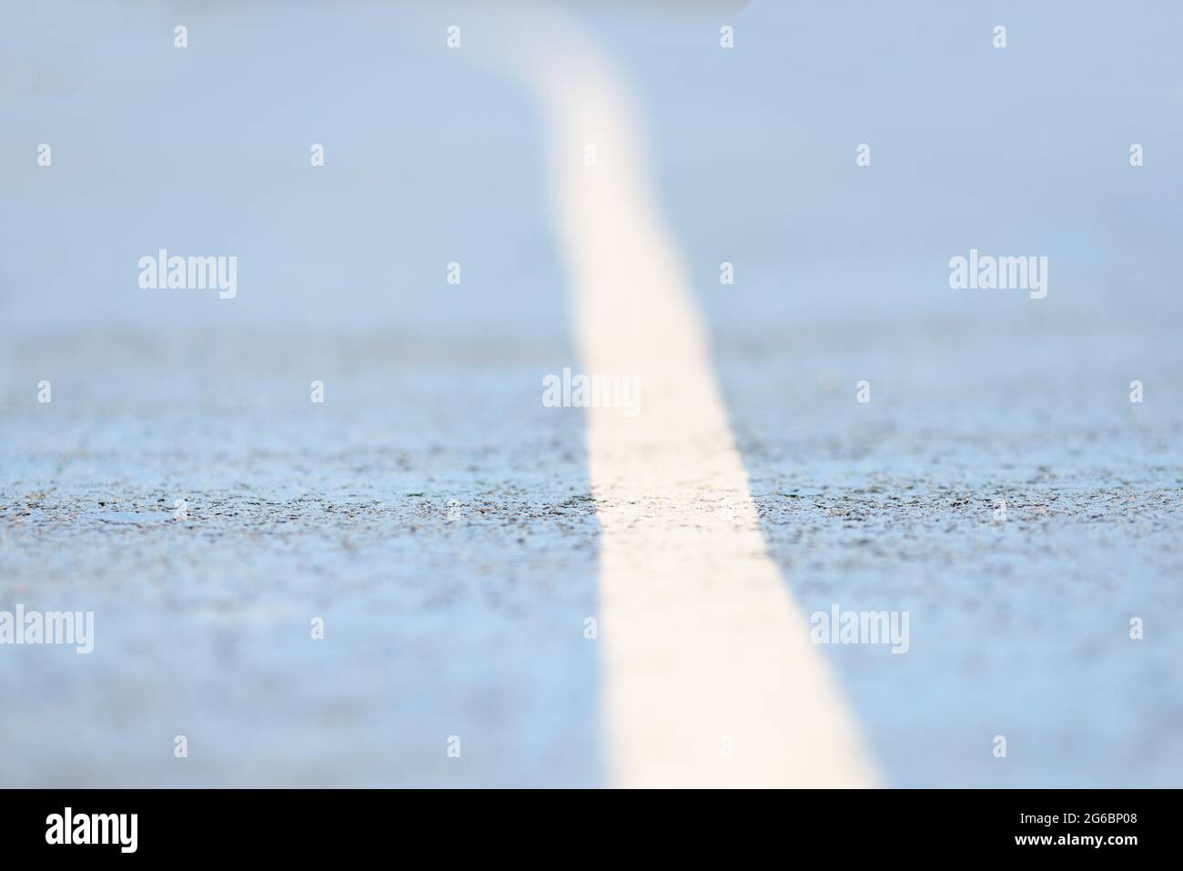Closeup of white dividing strip on road Stock Photo - Alamy