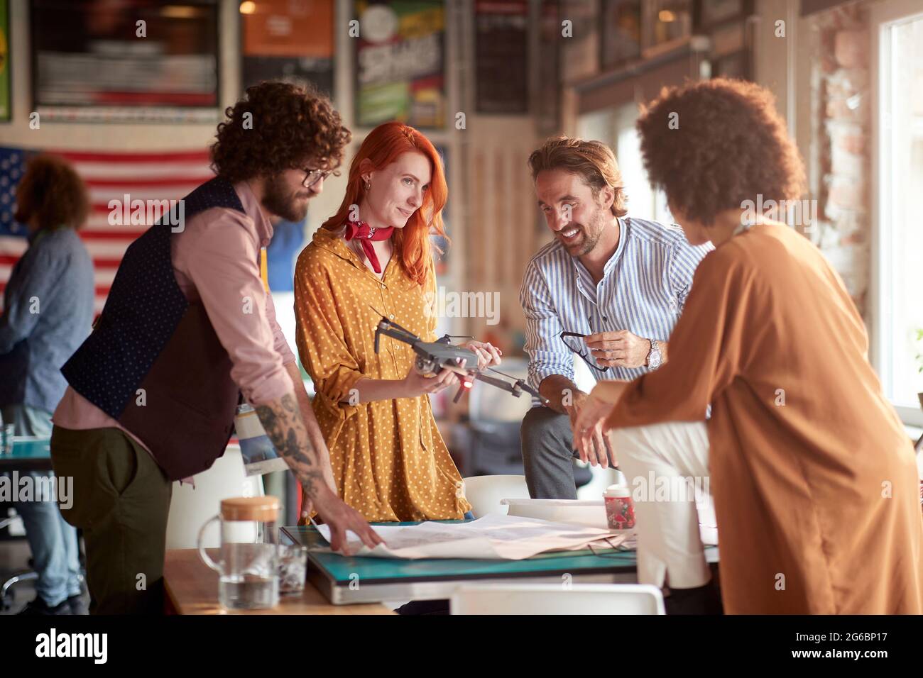 Group of young creative people in a pleasant atmosphere in the office ...